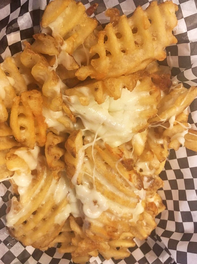Cheese fries that understand their assignment: be absolutely irresistible.