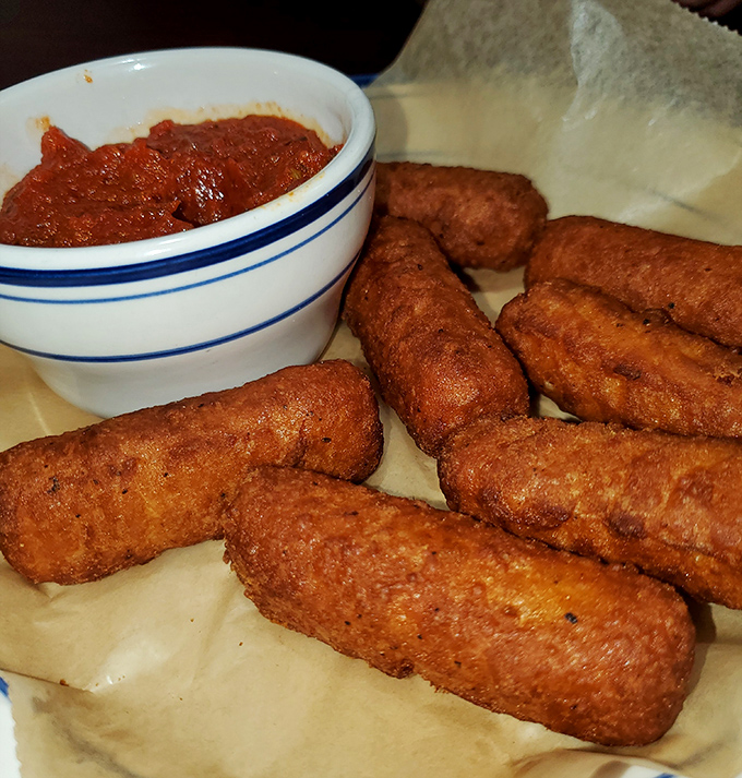 Cheese sticks that achieve that perfect balance: crunchy exterior, molten interior, and marinara for dunking. Comfort food engineering at its finest.