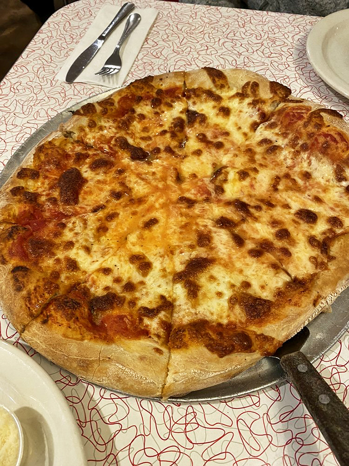 The plain cheese pizza&mdash;proof that perfection needs no embellishment. That caramelized cheese edge is worth fighting over.