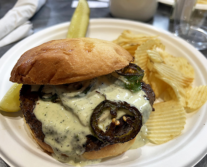This isn't just a burger&mdash;it's architecture with jalape&ntilde;os. The melty cheese and toasted bun create a handheld masterpiece worth the napkin investment.