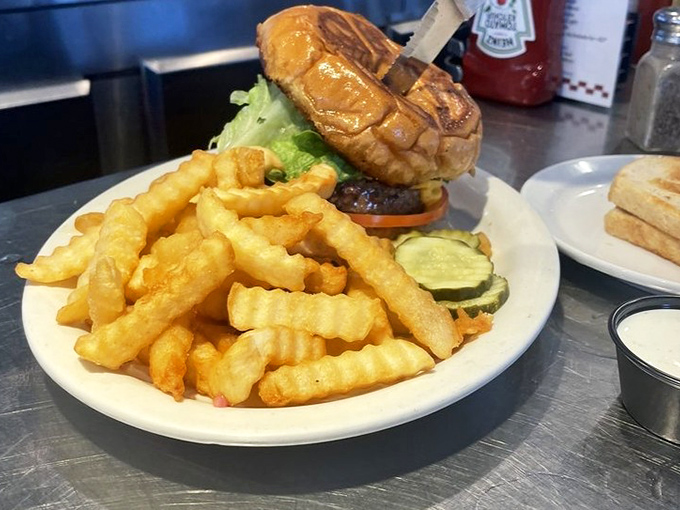 That burger's got more layers than a soap opera plot, and every single one is delicious drama.