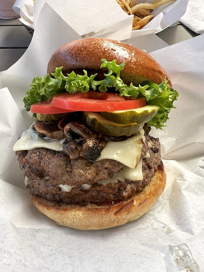 Behold the burger in its natural glory&mdash;juicy patty, melted cheese, and fresh toppings stacked so perfectly it belongs in the Smithsonian of sandwiches.