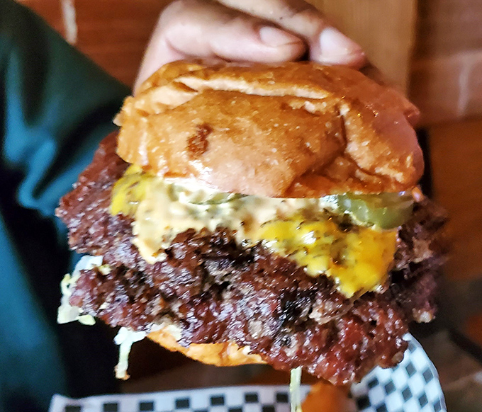 Behold the star of our show: a burger with the perfect meat-to-bun ratio, glistening with cheese and special sauce that might just haunt your dreams.