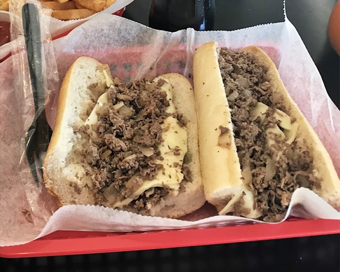 The classic Philly cheesesteak in its natural habitat. Thinly sliced beef and melted cheese nestled in a fresh roll&mdash;simplicity that conquered the world.