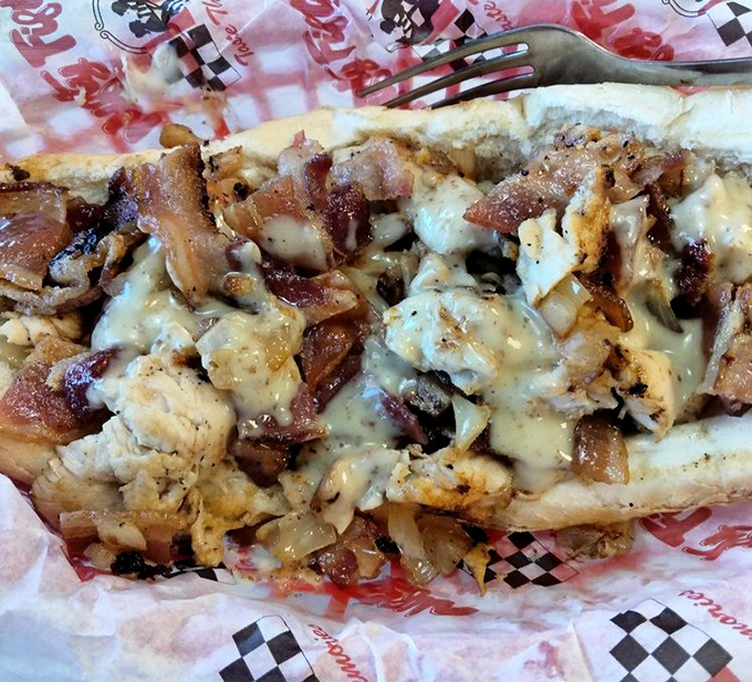 The Philly cheesesteak at Nifty Fifty's doesn't mess around—a beautiful mess of meat, cheese, and bread that demands both hands and several napkins.