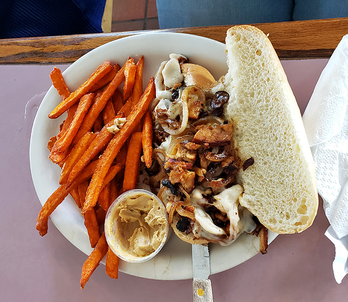 A sandwich that doesn't just satisfy hunger&mdash;it negotiates peace between sweet potato fries and savory fillings with diplomatic deliciousness.