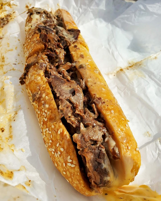 The cheesesteak in its paper wrapping&mdash;a beautiful simplicity that reminds us sometimes the best things come in the most unassuming packages.