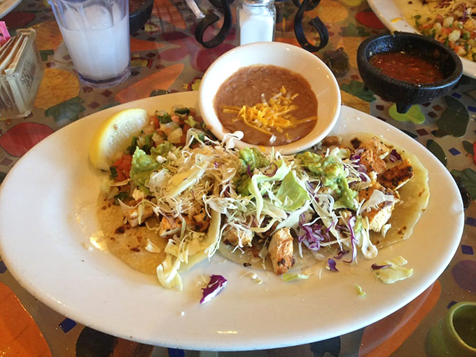 Tacos that demand to be photographed before eaten. The colorful toppings create a fiesta on the plate that's almost too pretty to disturb.