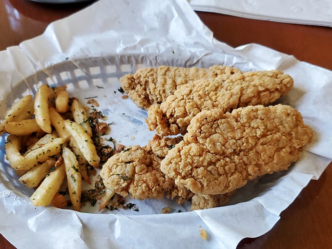 The chicken showcases crispy skin packed with ingredients, accompanied by those famous golden french fries everyone raves about.