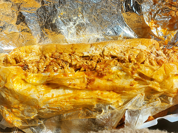 The chicken cheesesteak wrapped in foil like a gift&mdash;because that's exactly what it is to your taste buds.