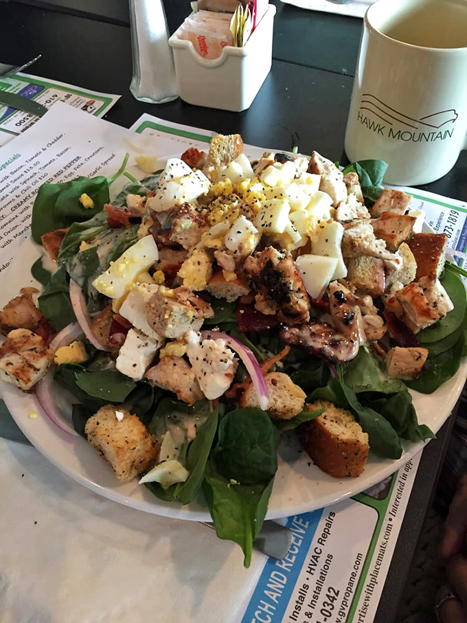 The legendary chicken finger salad &ndash; where crispy meets fresh in a plate-sized masterpiece that's worth every mile of the drive.