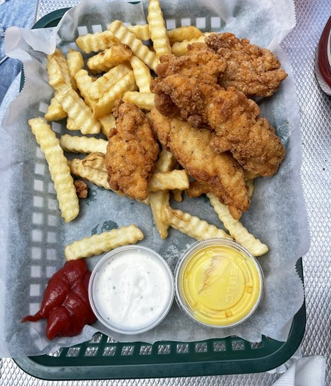 Crispy chicken tenders and crinkle-cut fries &ndash; proof that sometimes the simplest pleasures are the most satisfying, especially with two dipping sauces.