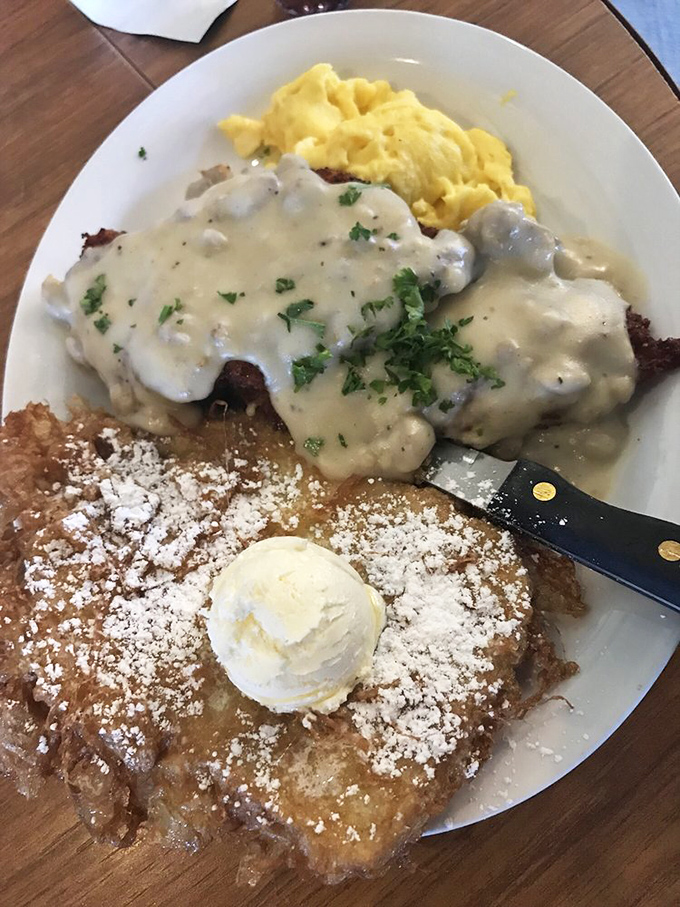 Chicken fried steak with gravy so good you'll want to bathe in it. The ultimate comfort food trifecta with eggs and pancakes.