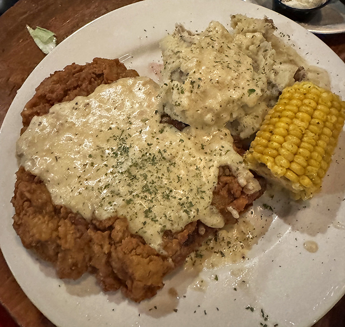 Chicken fried steak smothered in country gravy that your cardiologist warned you about. Worth every delicious, artery-clogging bite.