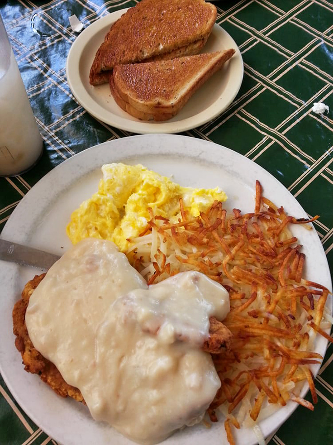 Chicken fried steak smothered in creamy gravy represents comfort food engineering at its most satisfying peak.