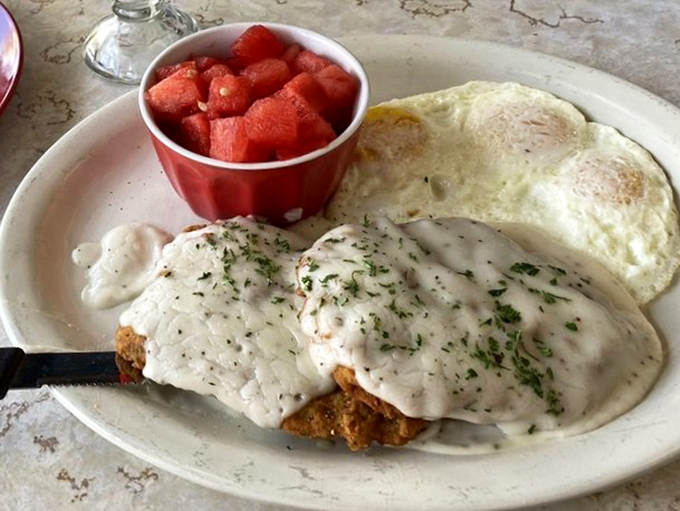 Country fried steak smothered in gravy that would make your grandmother both proud and slightly jealous of their recipe.