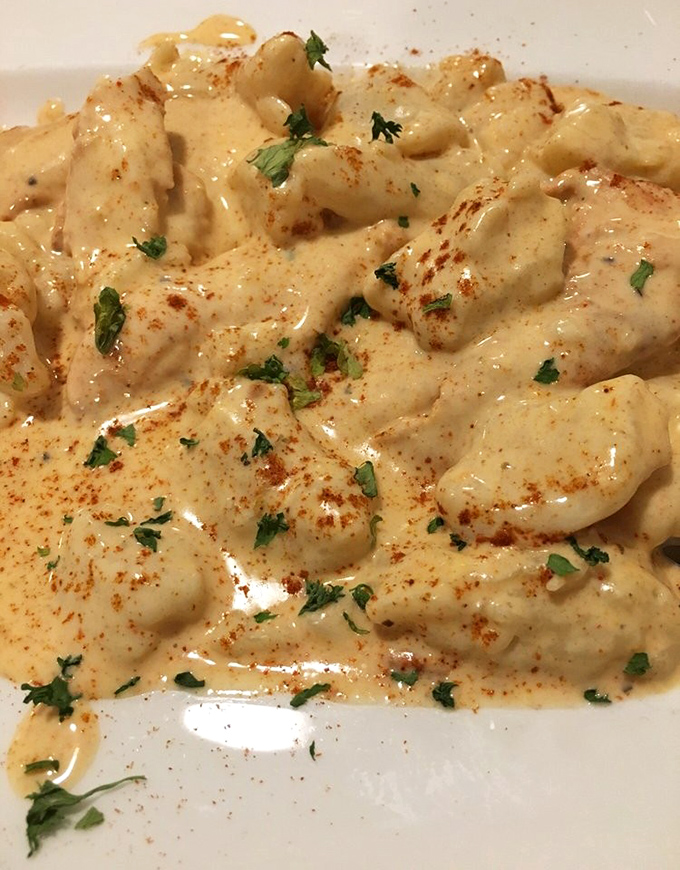 Tender chicken swimming in paprika-kissed sauce proves comfort food transcends all cultural boundaries beautifully.