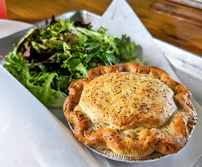 This chicken pot pie with its perfectly crimped edges isn't just comfort food&mdash;it's a warm hug served in an aluminum tin.