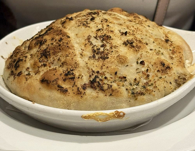 This chicken pot pie isn't just comfort food&mdash;it's a warm, herb-flecked hug under a golden dome of pastry perfection.