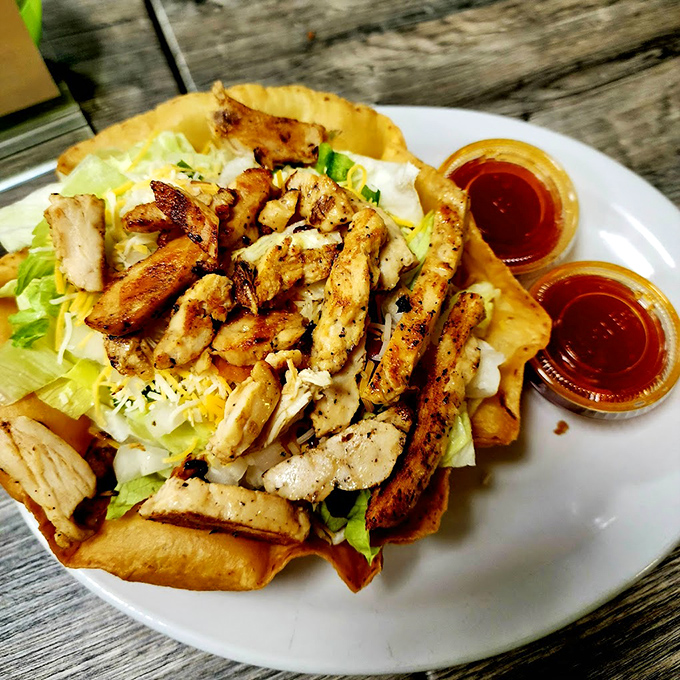 A taco salad that doesn't mess around &ndash; grilled chicken nestled in a crispy shell with all the fixings. Diet? What diet?