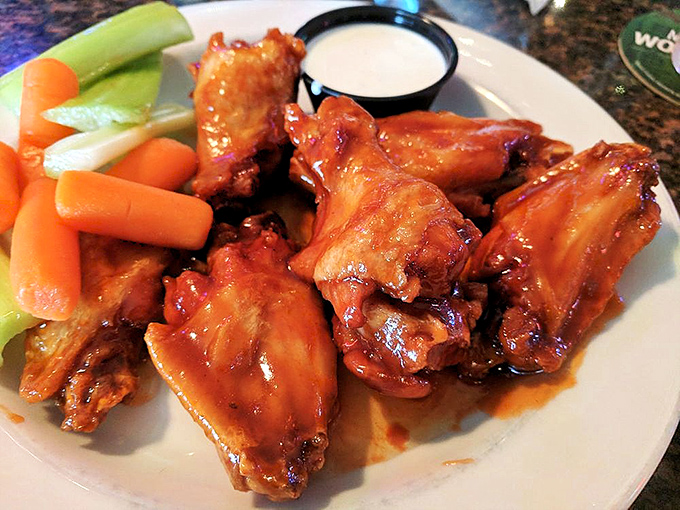 These wings aren't just coated in sauce&mdash;they're having a full-on flavor affair with it. The celery and carrots are just there to witness.