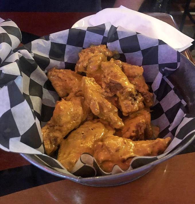 Wings that glow with that unmistakable Buffalo sheen &ndash; the kind that promises your taste buds a ticket to flavor town with no return trip planned.