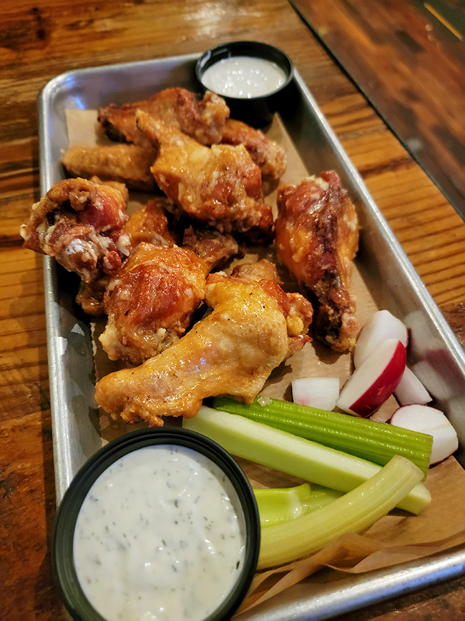 Wings that strike the perfect balance between crispy exterior and juicy interior. The celery and dipping sauces aren't afterthoughts&mdash;they're essential supporting characters.
