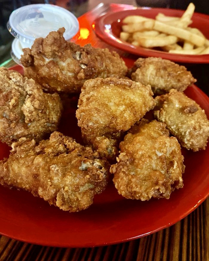 Even the chicken wings know they're in the presence of pizza royalty, crisping up golden brown as if to say, "We're worthy appetizers, your majesty."