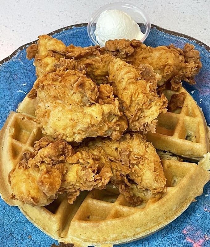 Whoever first decided to pair fried chicken with waffles deserves a Nobel Prize. This plate makes a compelling case for breakfast-dinner unity.