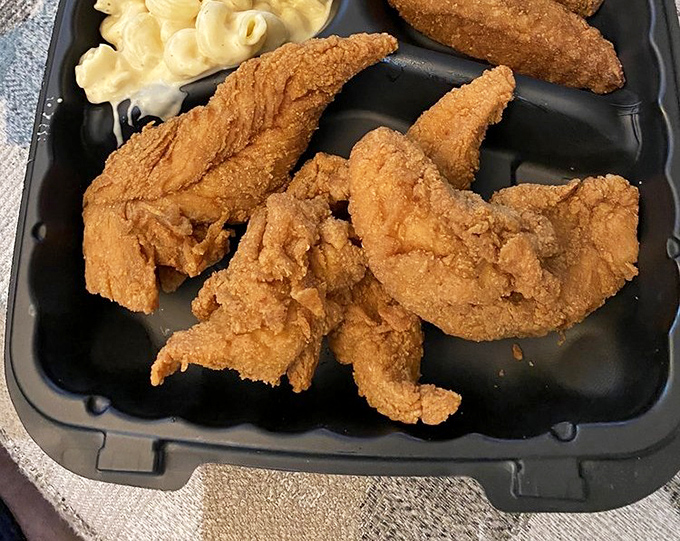 Golden-battered tenders and mac & cheese&mdash;proof that sometimes the simplest combinations create the most profound happiness on a plate.