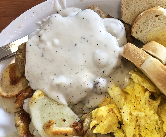 Country gravy cascading over potatoes and eggs&mdash;a breakfast worthy of champions or anyone who plans to nap afterward. Calories don't count on vacation.