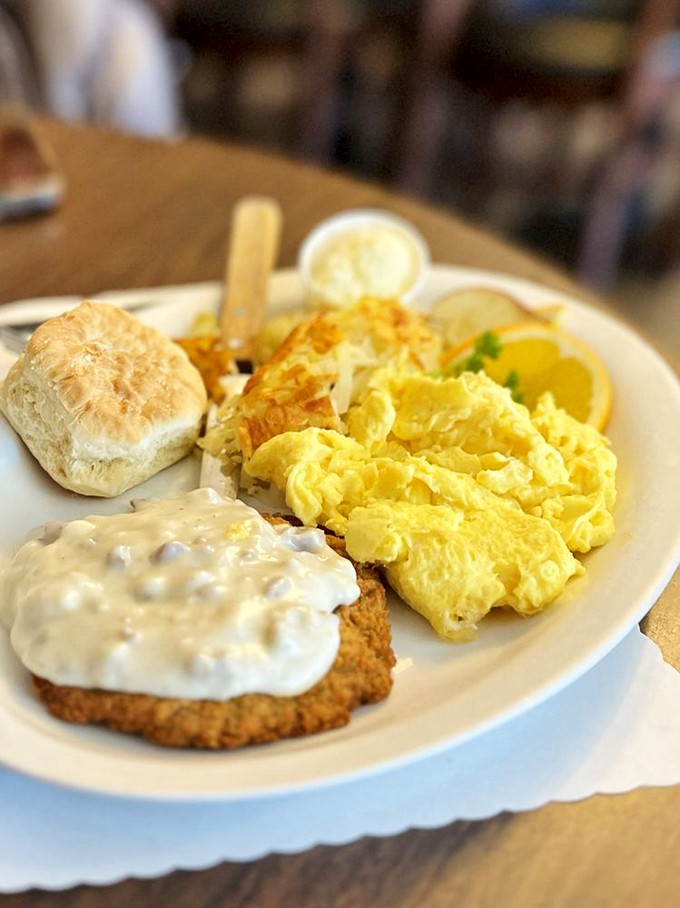 This country-style breakfast with chicken fried steak isn't just a meal—it's a commitment, a declaration, and possibly the reason elastic waistbands were invented.