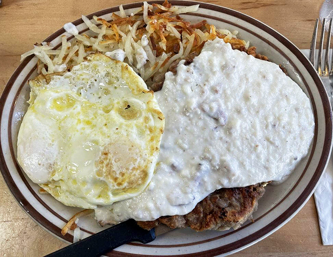 The chicken fried steak and eggs &ndash; where crispy, savory coating meets creamy country gravy in a breakfast romance that's lasted generations.