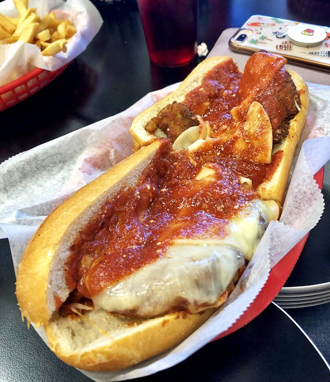 The chicken parm sandwich: where Italian-American comfort food meets Philadelphia sandwich craftsmanship in a sauce-laden love affair.