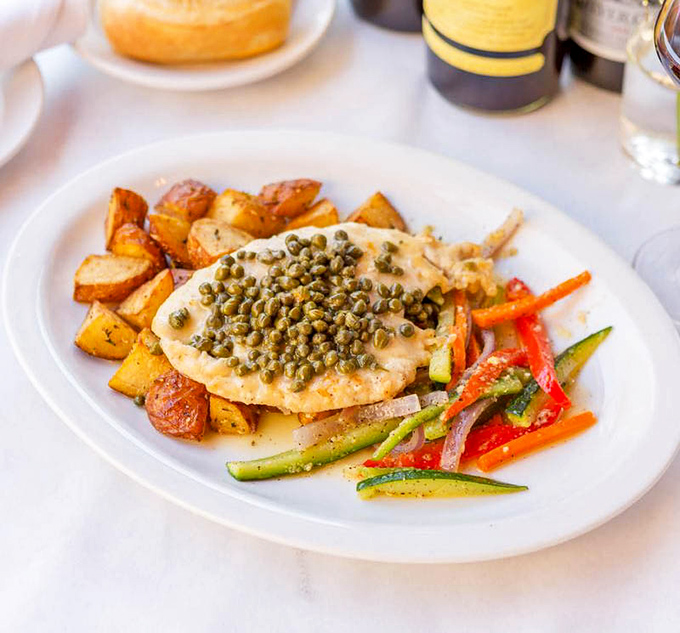 The Chicken Piccata speaks the universal language of comfort&mdash;golden cutlets crowned with briny capers alongside colorful vegetables and roasted potatoes.