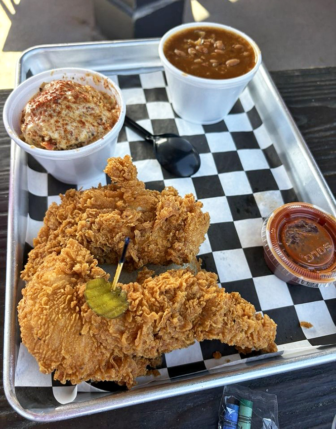 The holy trinity of Southern comfort: perfectly fried chicken, soul-warming beans, and mac and cheese that means serious business.