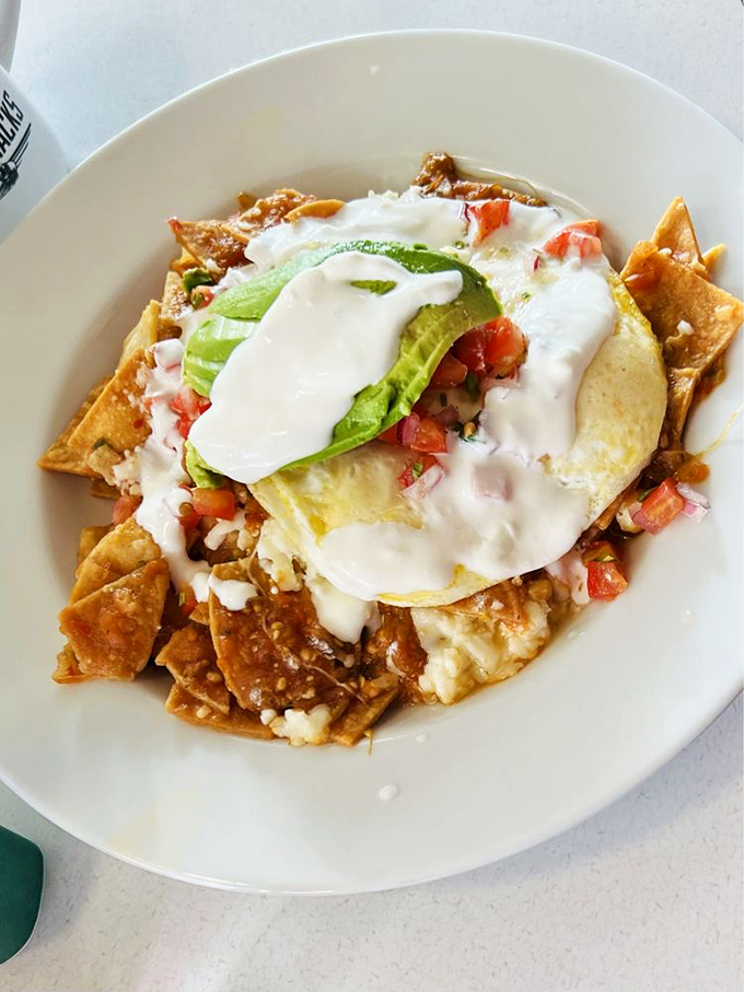 Chilaquiles that could heal a broken heart &ndash; crispy tortilla chips swimming in sauce, crowned with a sunny-side-up egg and avocado.
