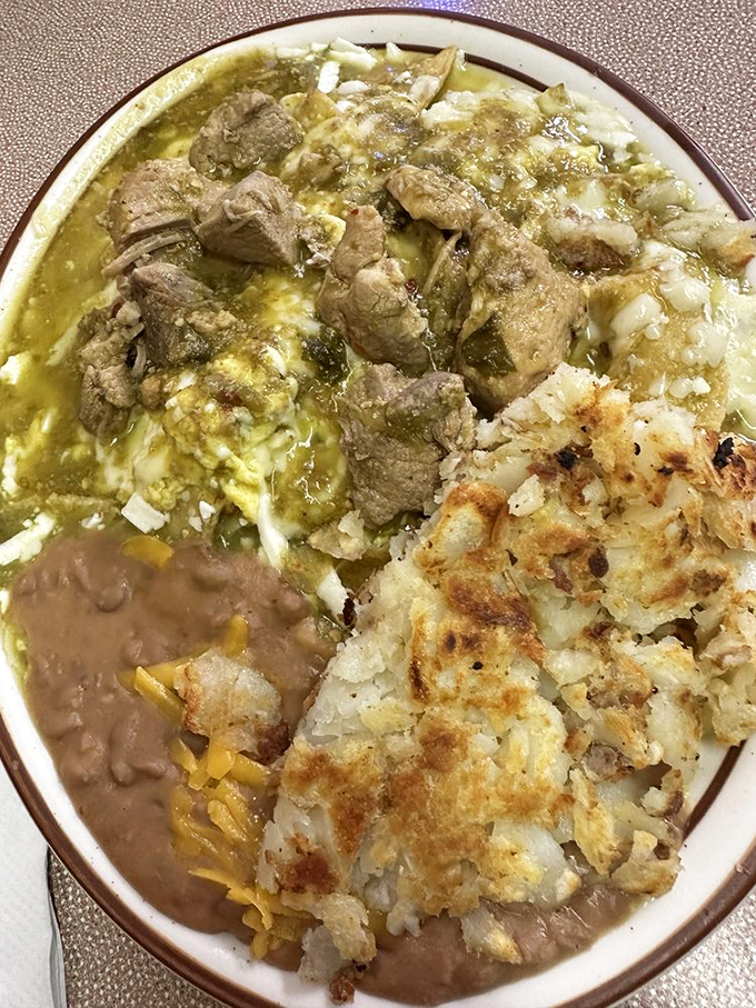 Chile verde chilaquiles with crispy potatoes &ndash; a morning fiesta that makes your standard breakfast seem like it's not even trying.