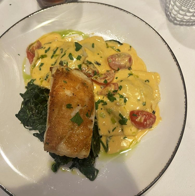 Chilean Sea Bass so perfectly seared it practically has its own fan club&mdash;perched atop spinach like royalty surveying its delicious kingdom.