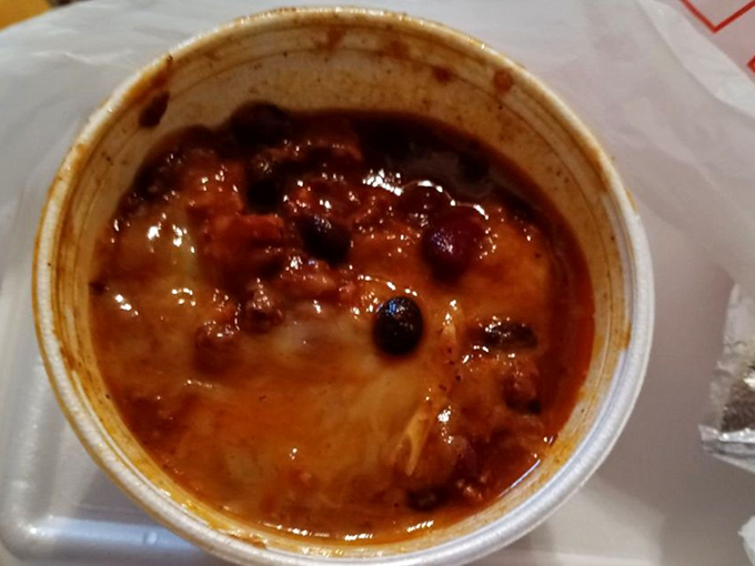 Bean-studded chili that's clearly been simmering with purpose. The steam rising isn't just heat&mdash;it's aromatic evidence of low-and-slow dedication.