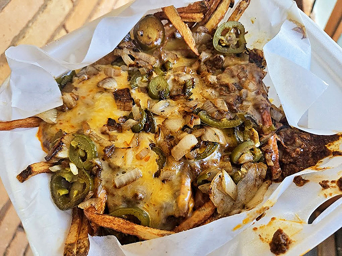 Chili cheese fries that transform a simple side into a hearty meal worth driving across town for.