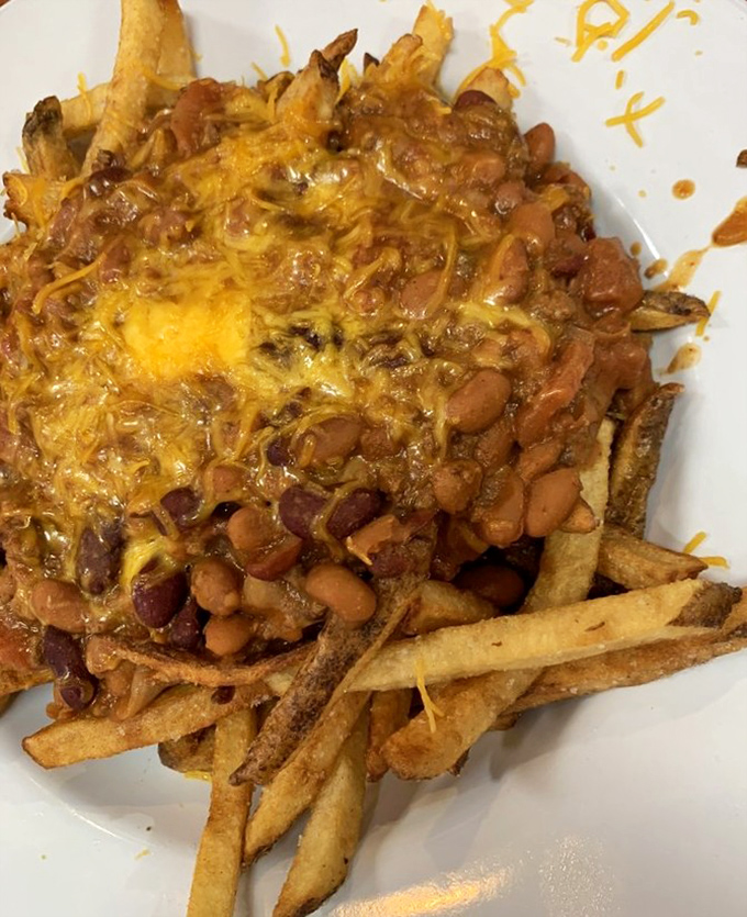 Chili cheese fries: where diet plans go to die and happiness is measured in how far you can stretch that glorious cheese pull.