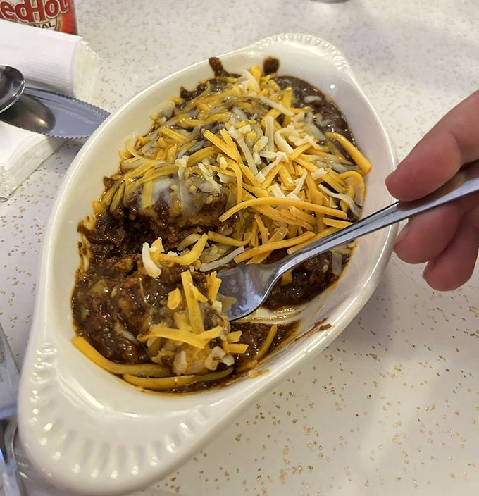 Comfort in a bowl! This chili topped with a snowfall of cheese is what Midwesterners dream about when the temperature drops below freezing.