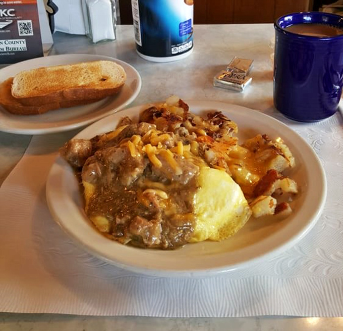 Breakfast nirvana: eggs, potatoes, and gravy coming together in a plate that says "good morning" better than any alarm clock ever could.