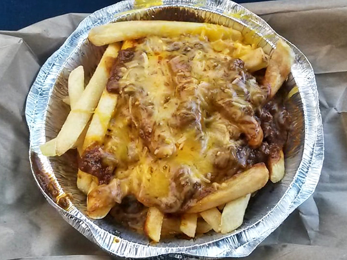 Chili cheese fries that demand to be shared but taste too good to actually do so. The ultimate comfort food compromise.