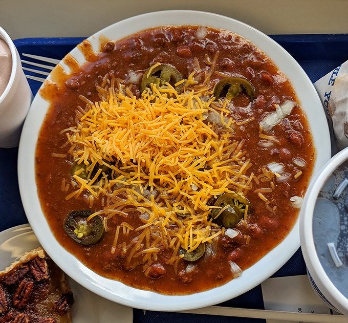 Behold, the famous chili in all its glory&mdash;a spiced symphony topped with a snowfall of cheddar and jalape&ntilde;o islands.