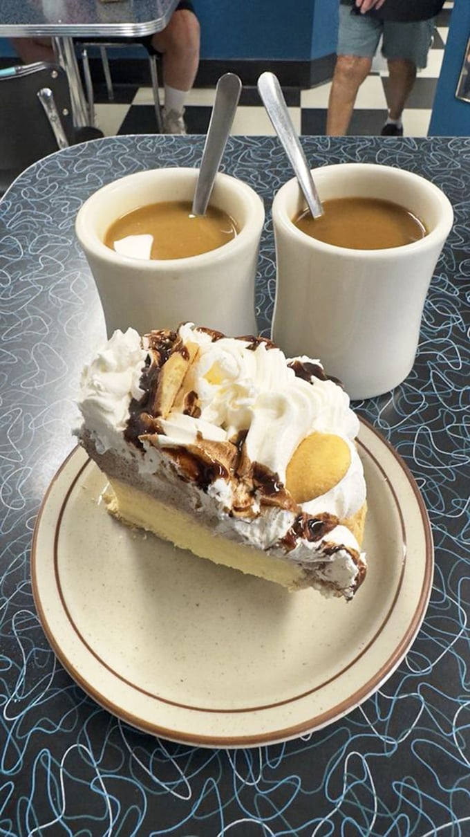 Coffee and pie &ndash; civilization's perfect pairing. This banana cream masterpiece with chocolate drizzle makes a compelling case for dessert before noon.