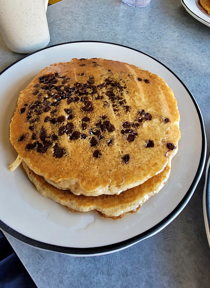 Chocolate chip pancakes that would make Willy Wonka jealous&mdash;golden discs studded with melty chocolate morsels waiting for their maple bath.