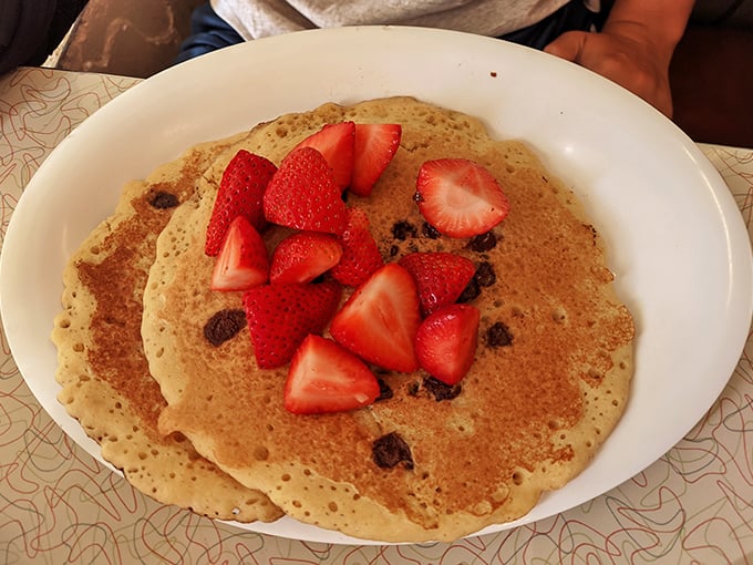 Pancakes dotted with chocolate chips and crowned with fresh strawberries. Breakfast or dessert? At Silver Skillet, no one's judging either way.