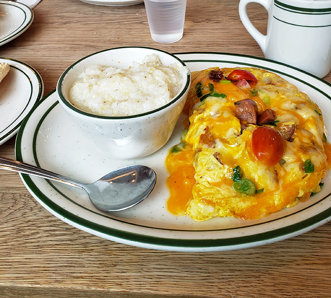 An omelet that's having an identity crisis as a work of art. Fresh spinach and what appears to be seafood create a protein masterpiece.
